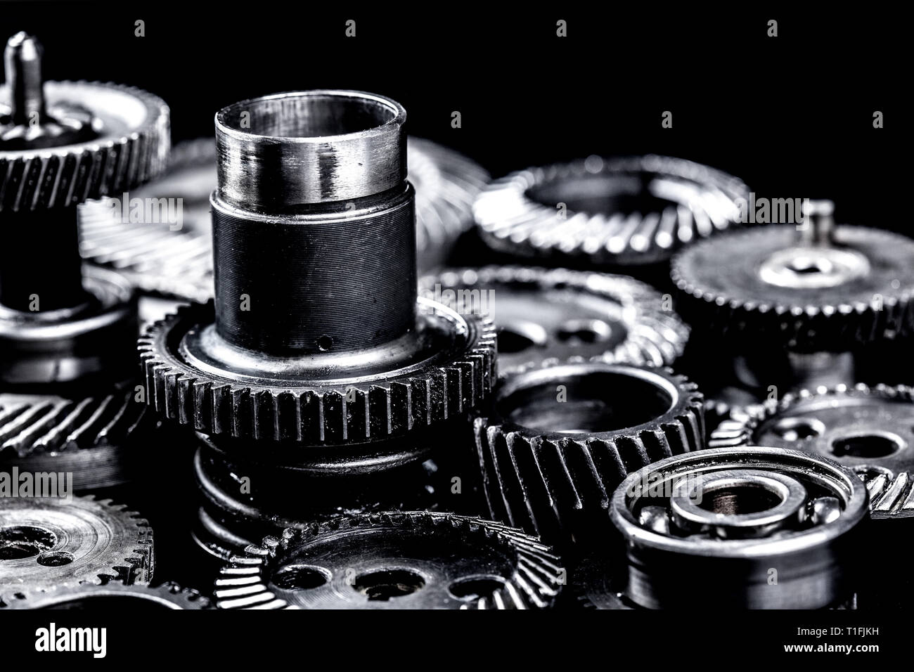 Metal gears on black background Stock Photo - Alamy