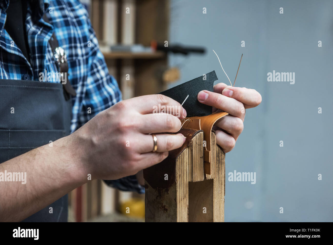 Concept of handmade craft production of leather goods Stock Photo - Alamy