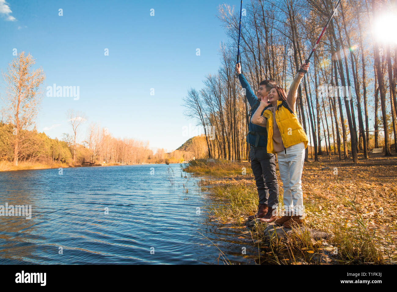 Young men and women outdoor outing Stock Photo - Alamy