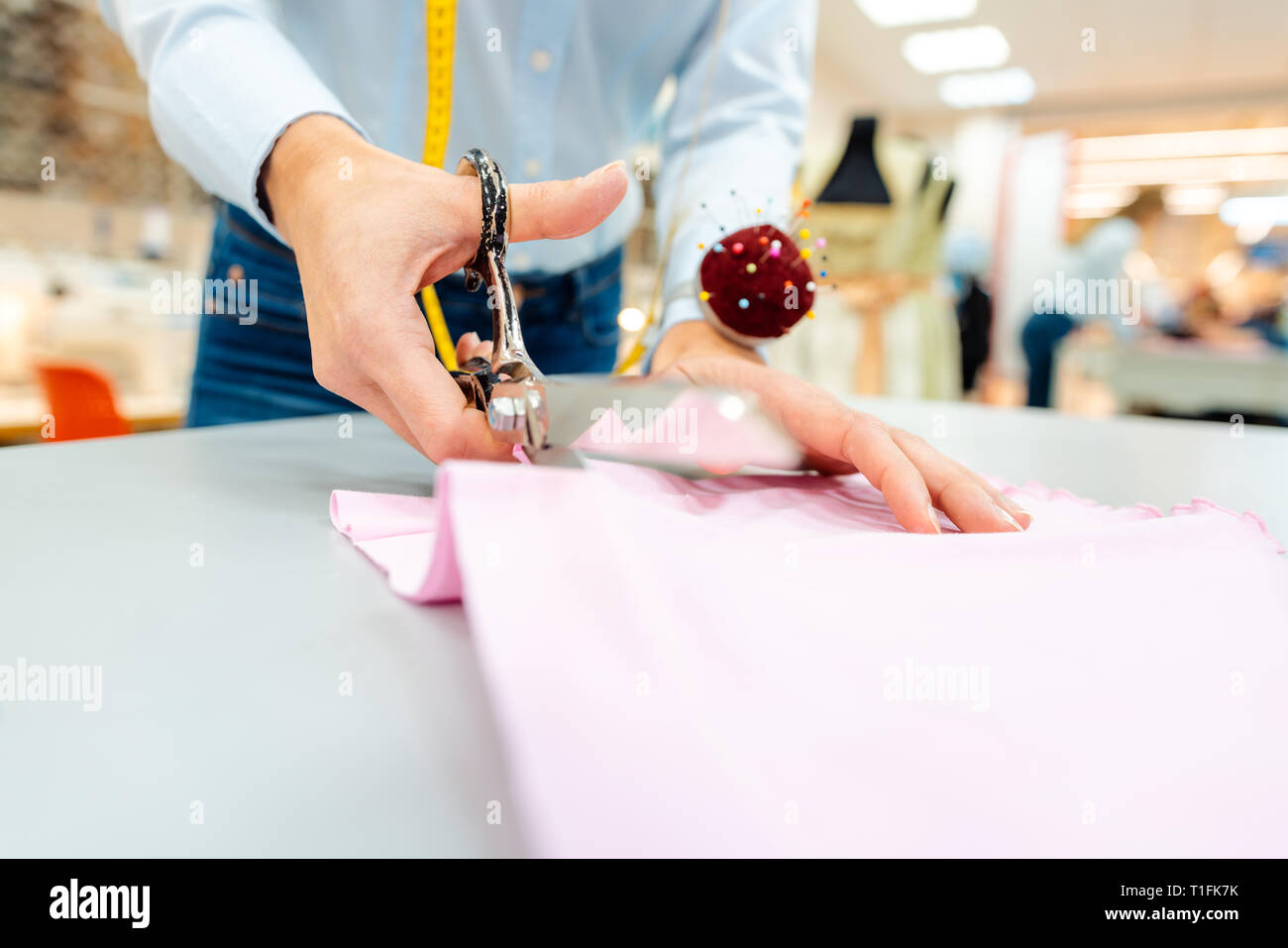 Cutting fabric hi-res stock photography and images - Alamy