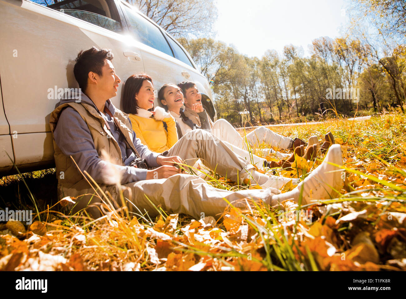 Young men and women in the outdoor outing Stock Photo - Alamy