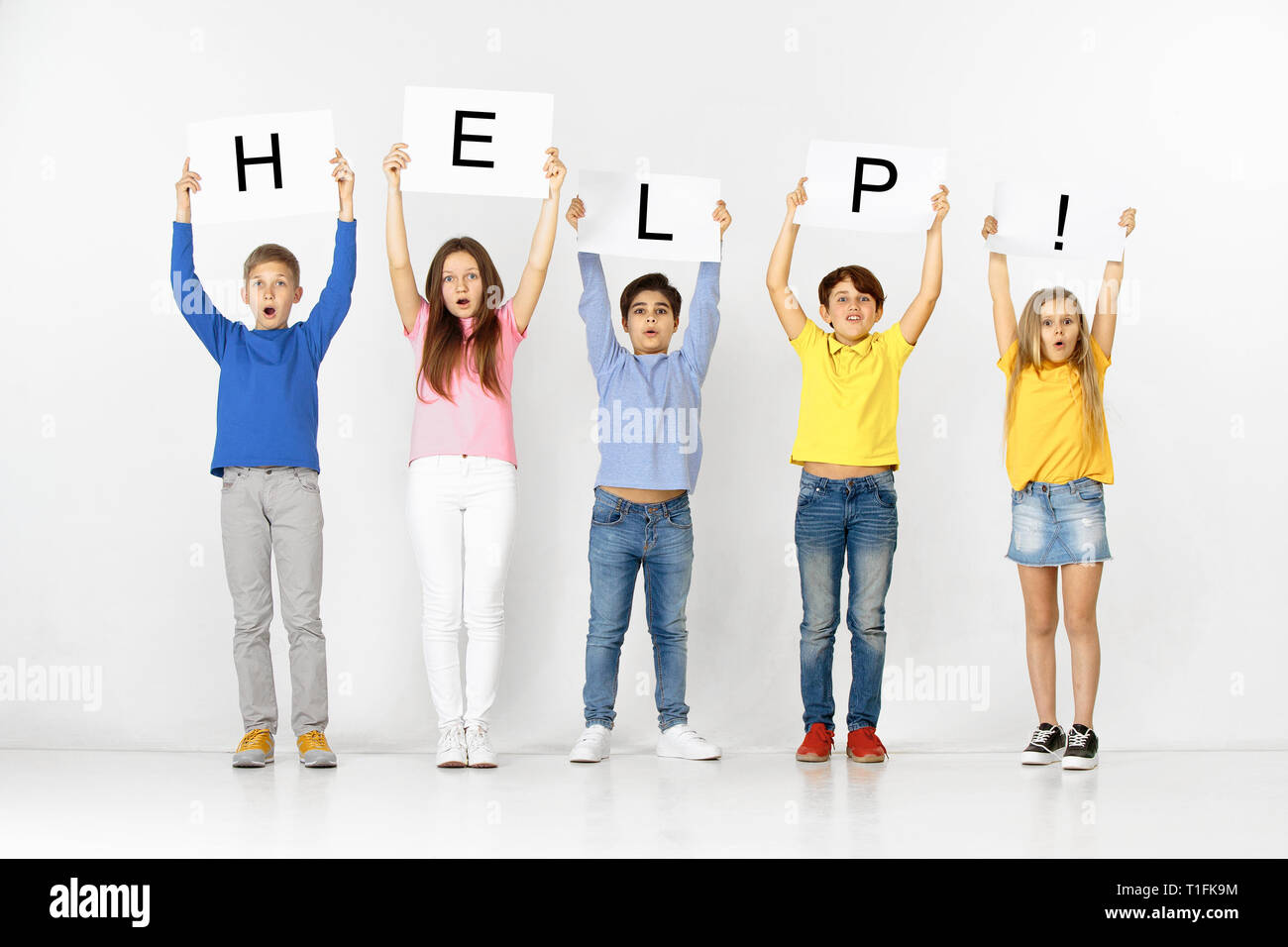 Give help to your friend. Group of astonished and surprised children ...