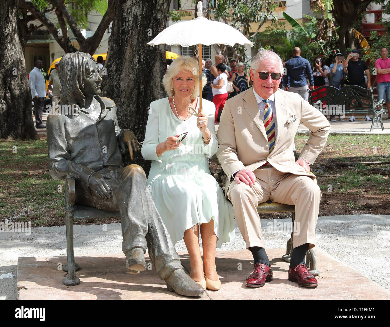 The Prince of Wales and the Duchess of Cornwall sit on the John Lennon ...