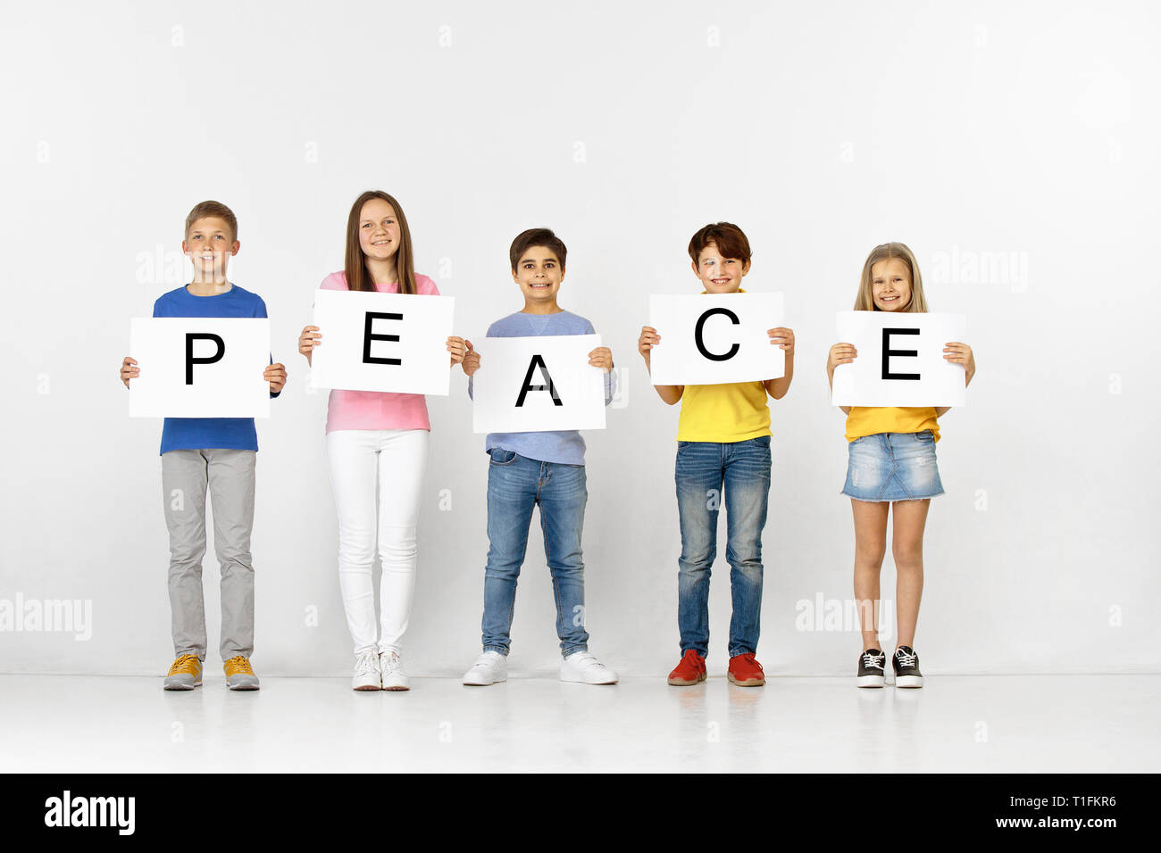 No war for peace. Group of happy smiling children with a white banners ...