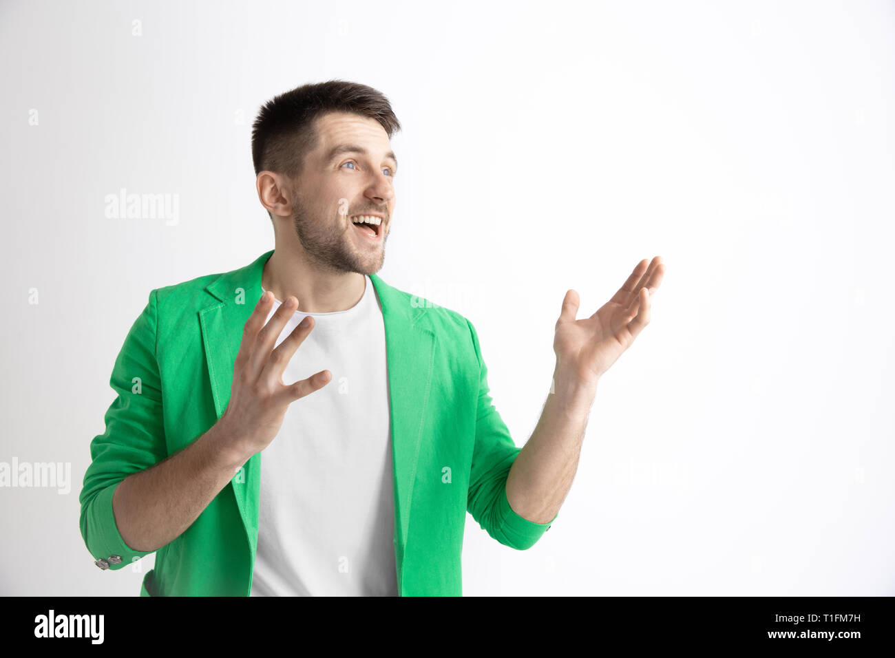 Happy business man standing, smiling isolated on gray studio background ...