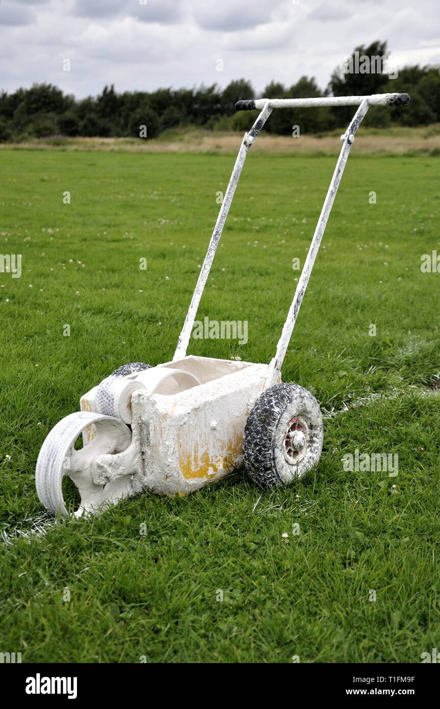 Line painting marking hand operated white barrow paint Stock Photo - Alamy