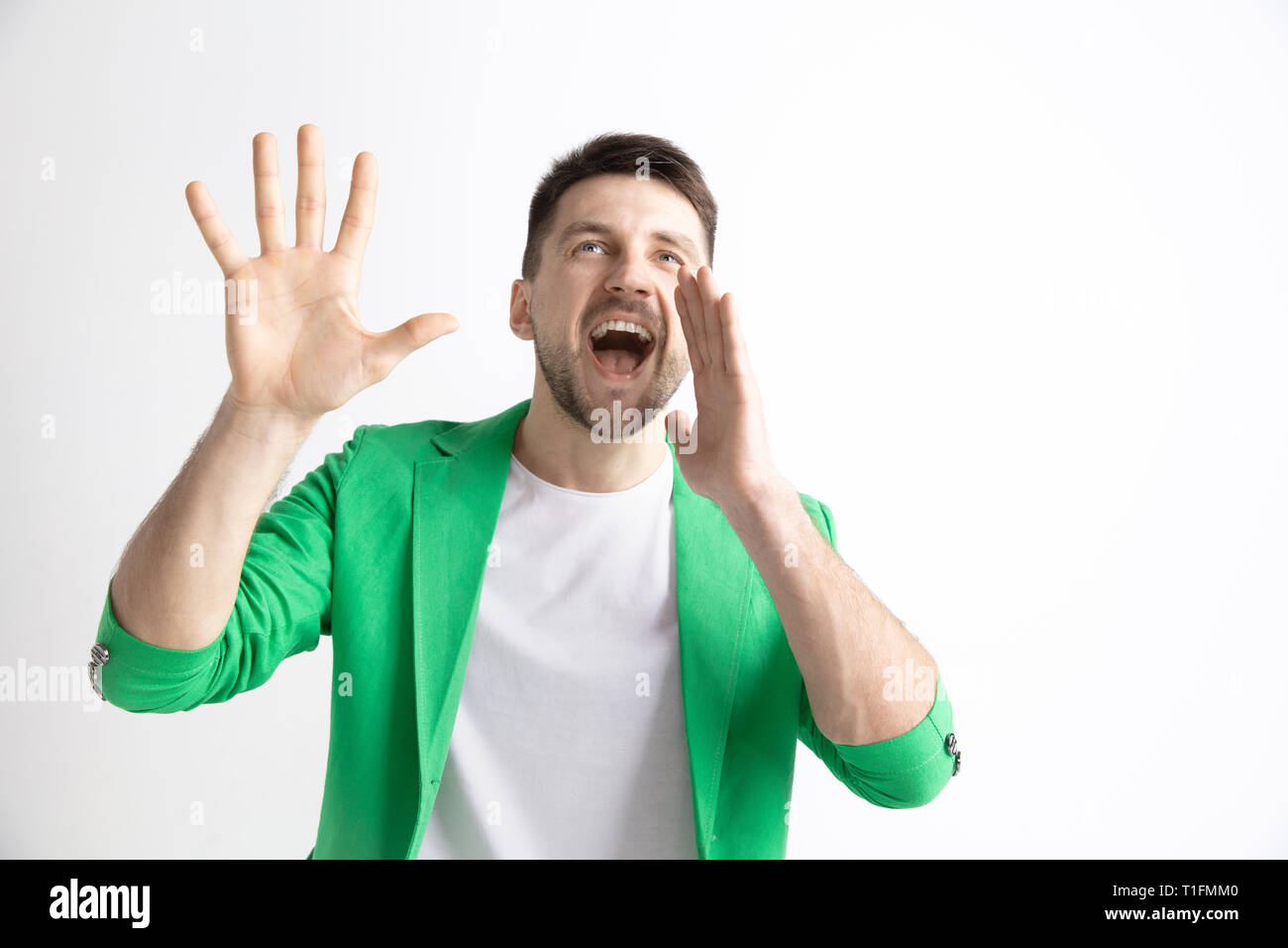 Young casual man shouting. Shout. Crying emotional man screaming on ...