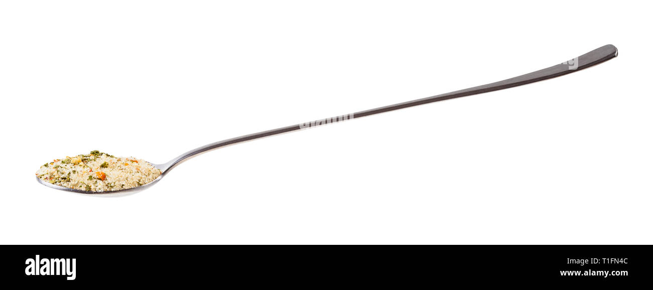 side view of steel teaspoon with seasoned salt with dried vegetables ...