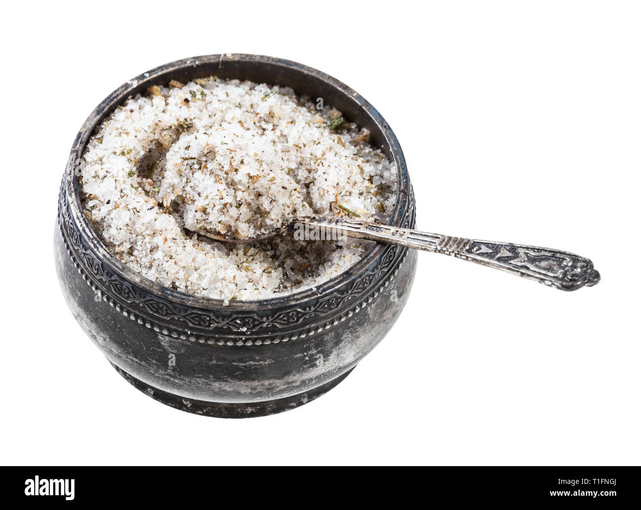old silver salt cellar with spoon with seasoned salt with spices and ...
