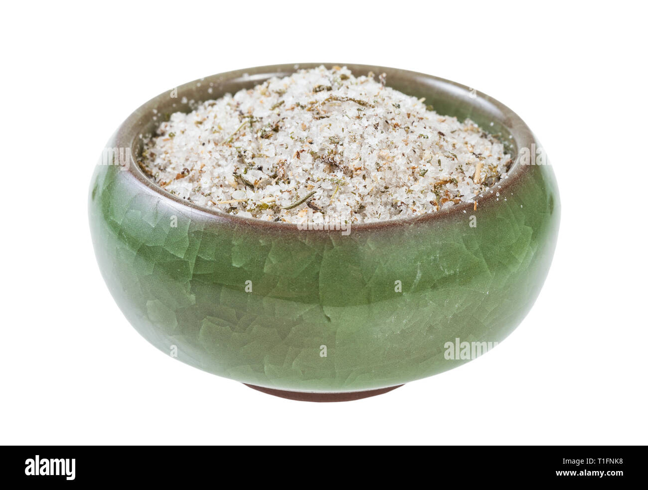 side view of ceramic salt cellar with seasoned salt with spices and ...