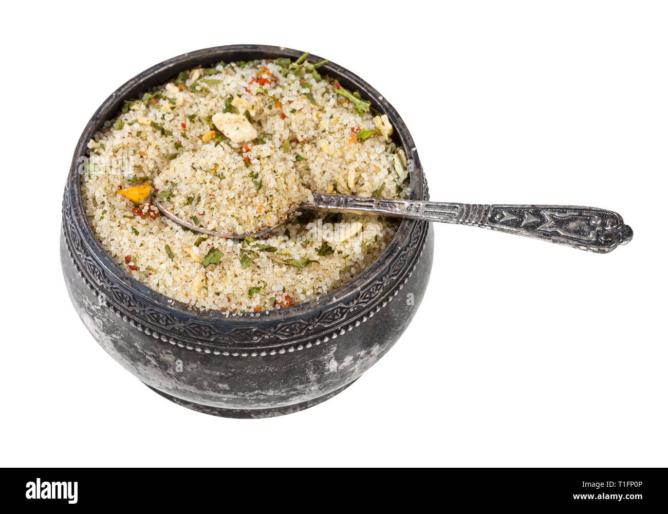 old silver salt cellar with spoon with seasoned salt with dried ...