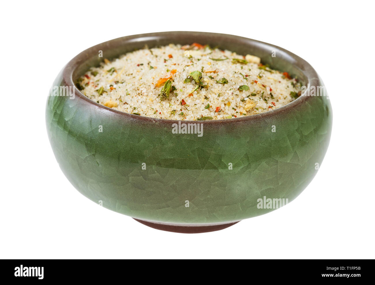 side view of ceramic salt cellar with seasoned salt with dried ...