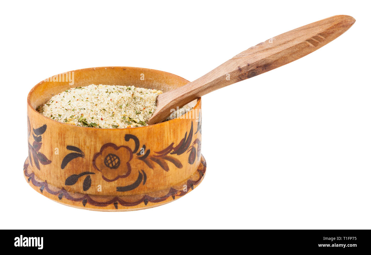 side view of wooden salt cellar with spoon with seasoned salt with ...