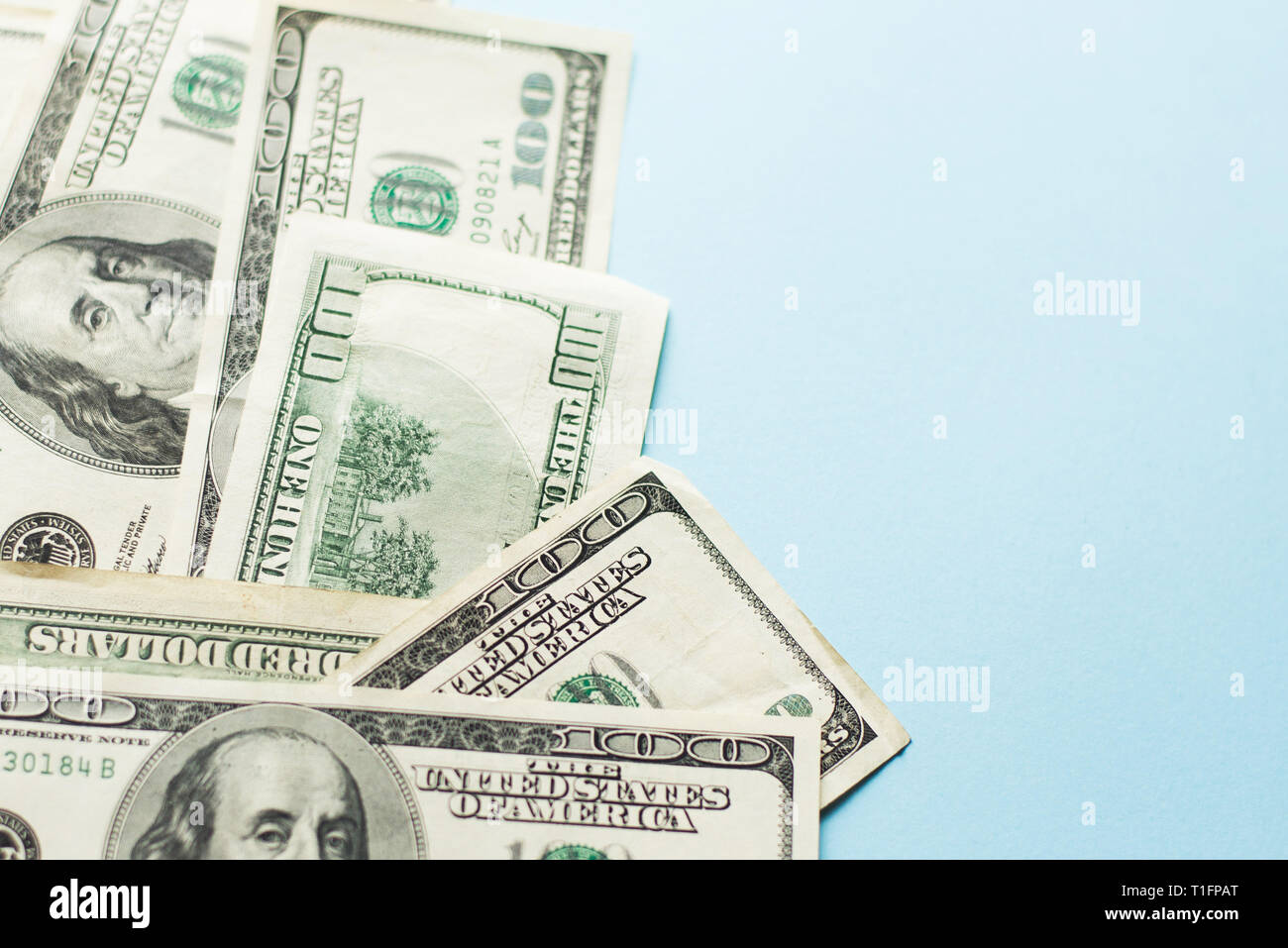Hundred dollars bill on light blue background Stock Photo - Alamy