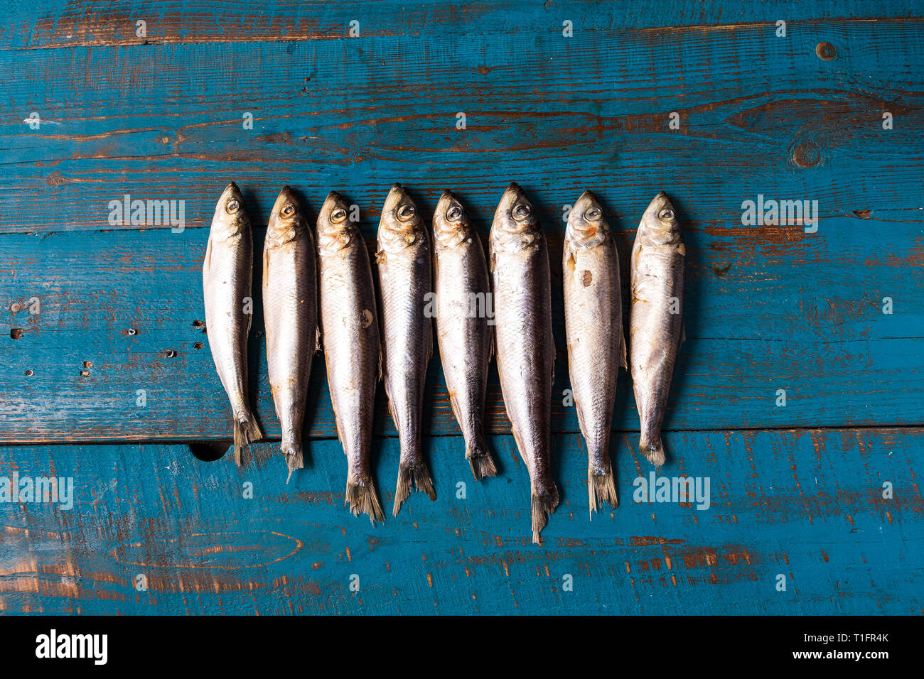 Rustic style. Fish pattern. Herring fish on an old blue wooden ...
