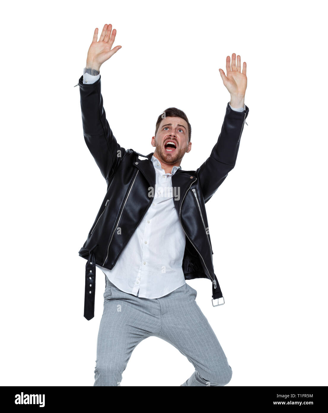 front view man protects hands from what is falling from above. Man ...