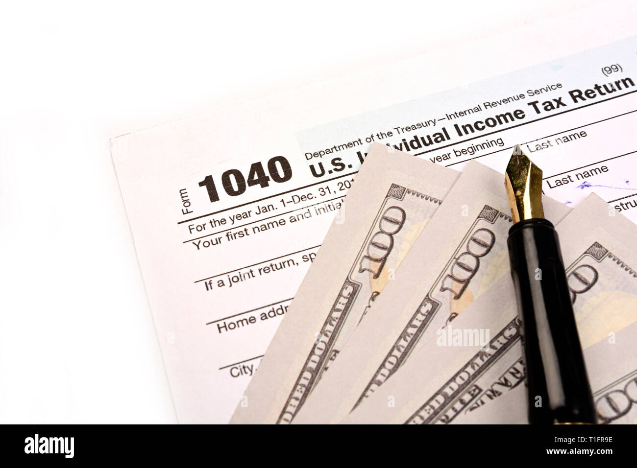 Completing US tax return form 1040 on white background Stock Photo - Alamy