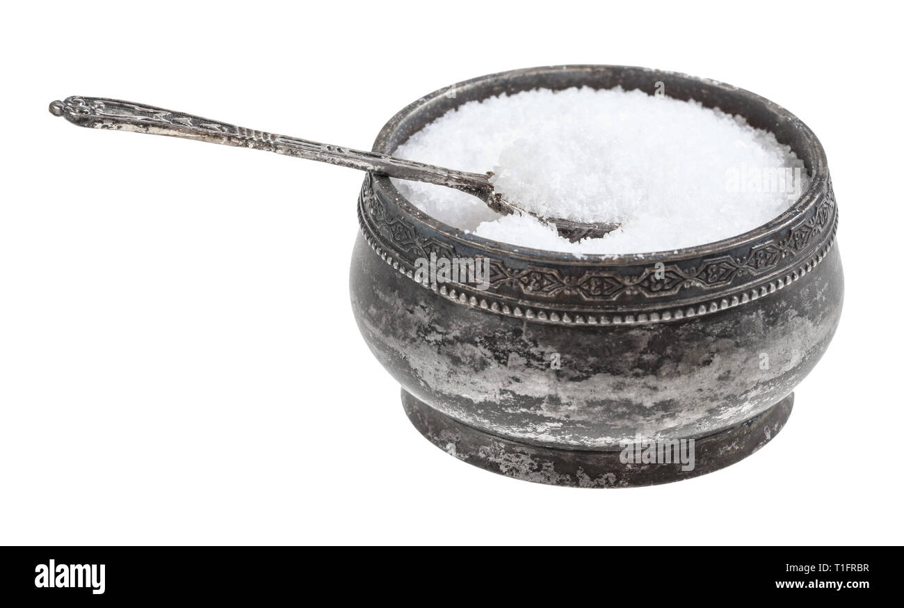 side view of old silver salt cellar with spoon with fine ground Sea ...