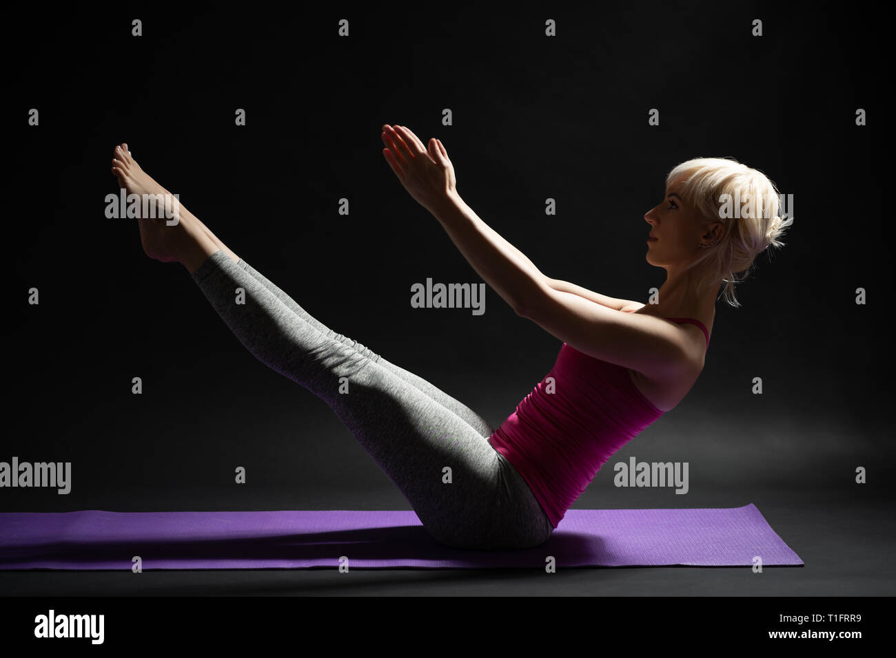 Woman exercising pilates. Teaser exercise Stock Photo - Alamy