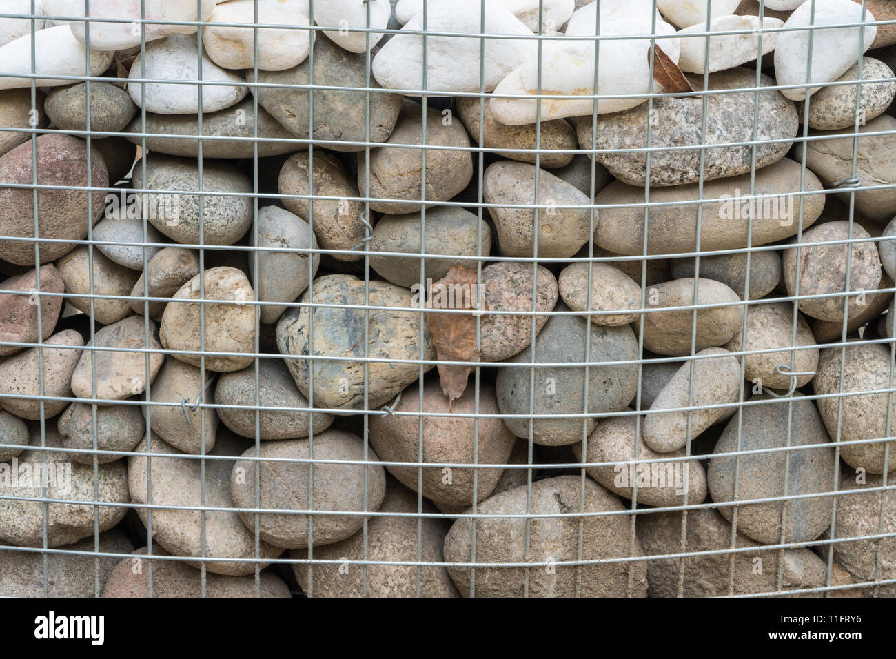 Stone wall rounded stones hi-res stock photography and images - Alamy