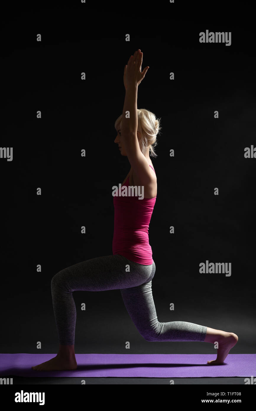 Woman exercising pilates. Static lunge exercise Stock Photo - Alamy