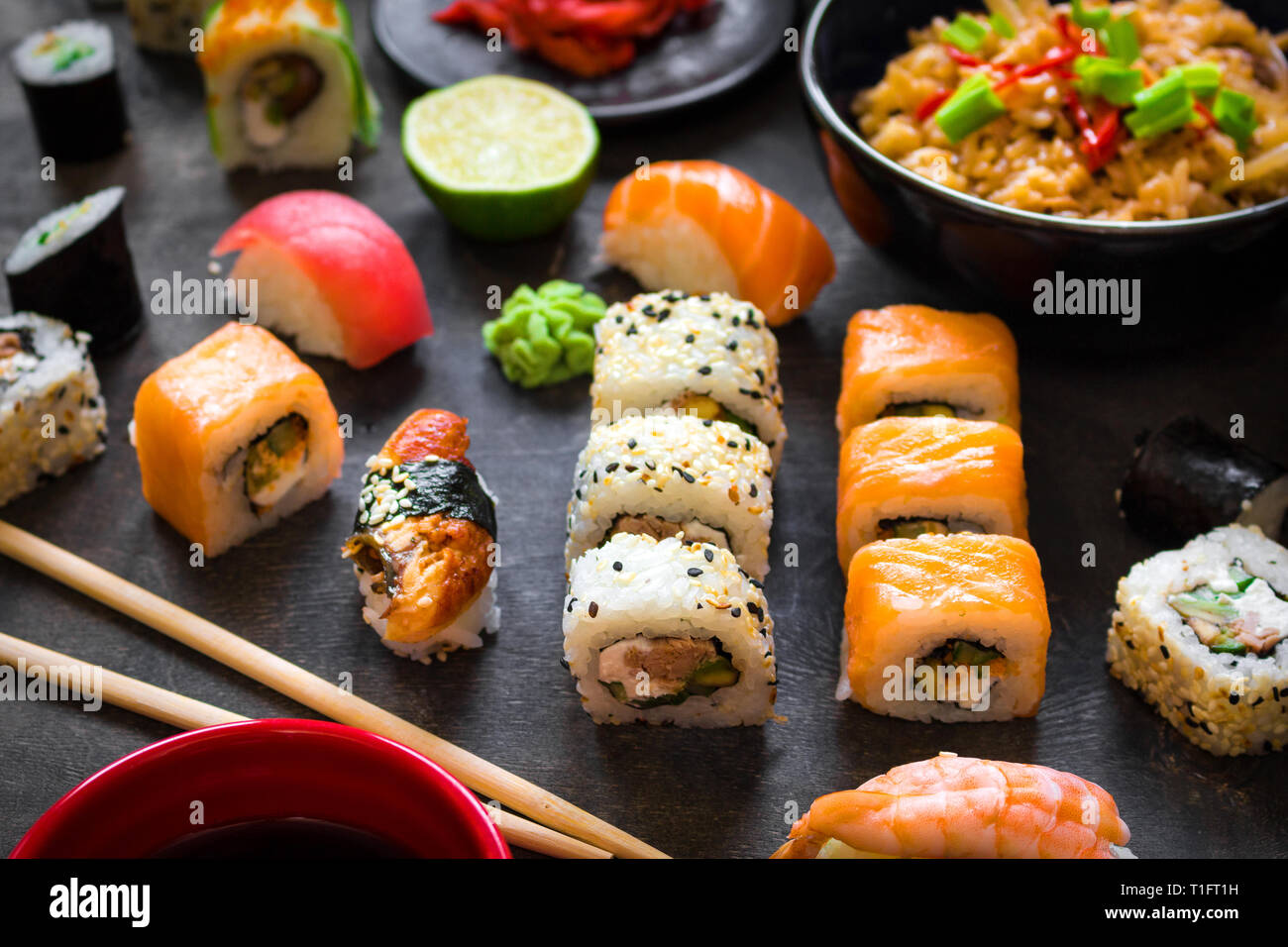 Table served with sushi and traditional japanese food Stock Photo - Alamy