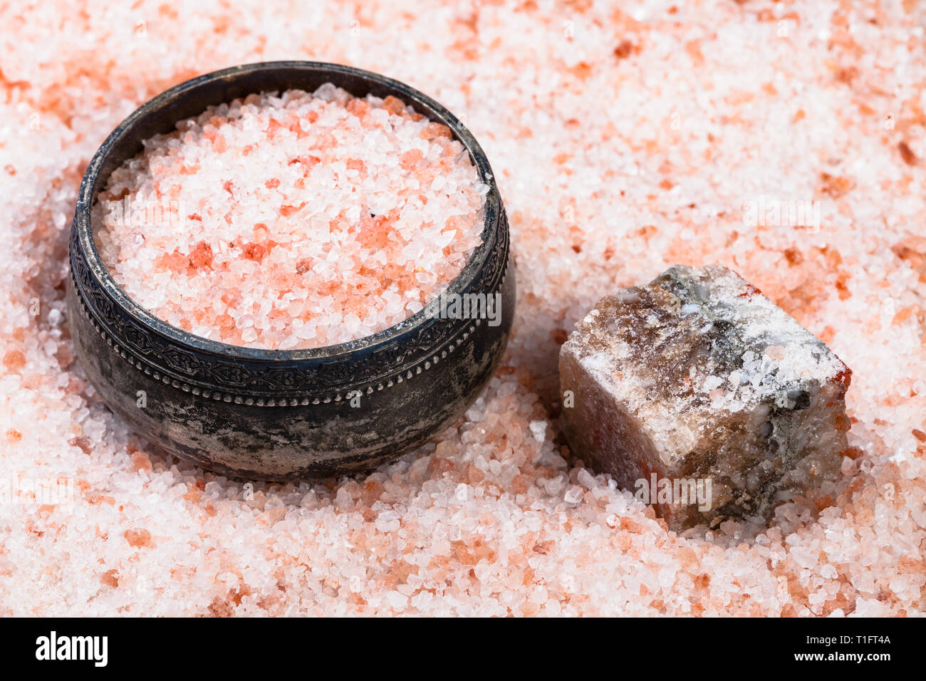 old silver salt cellar, raw natural pink Halite mineral and grained ...