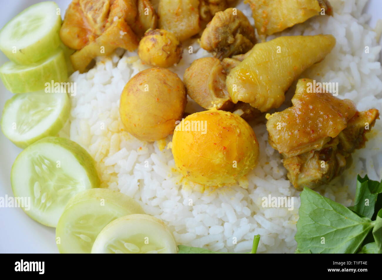 spicy chicken curry on plain rice Stock Photo - Alamy