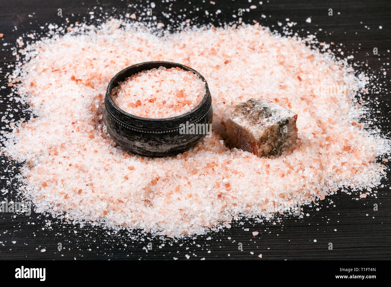 old silver salt cellar, raw natural pink Halite mineral and grained ...