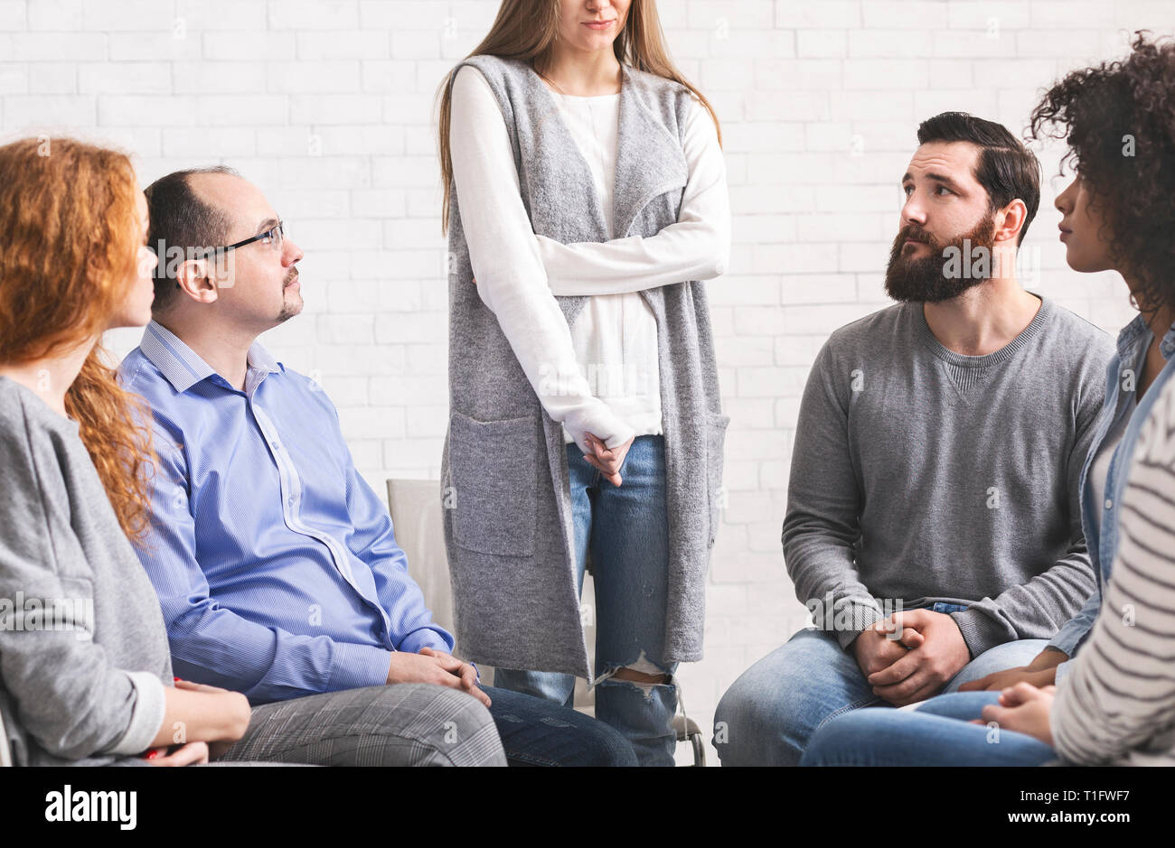Young woman talking about her feelings during group therapy Stock Photo ...