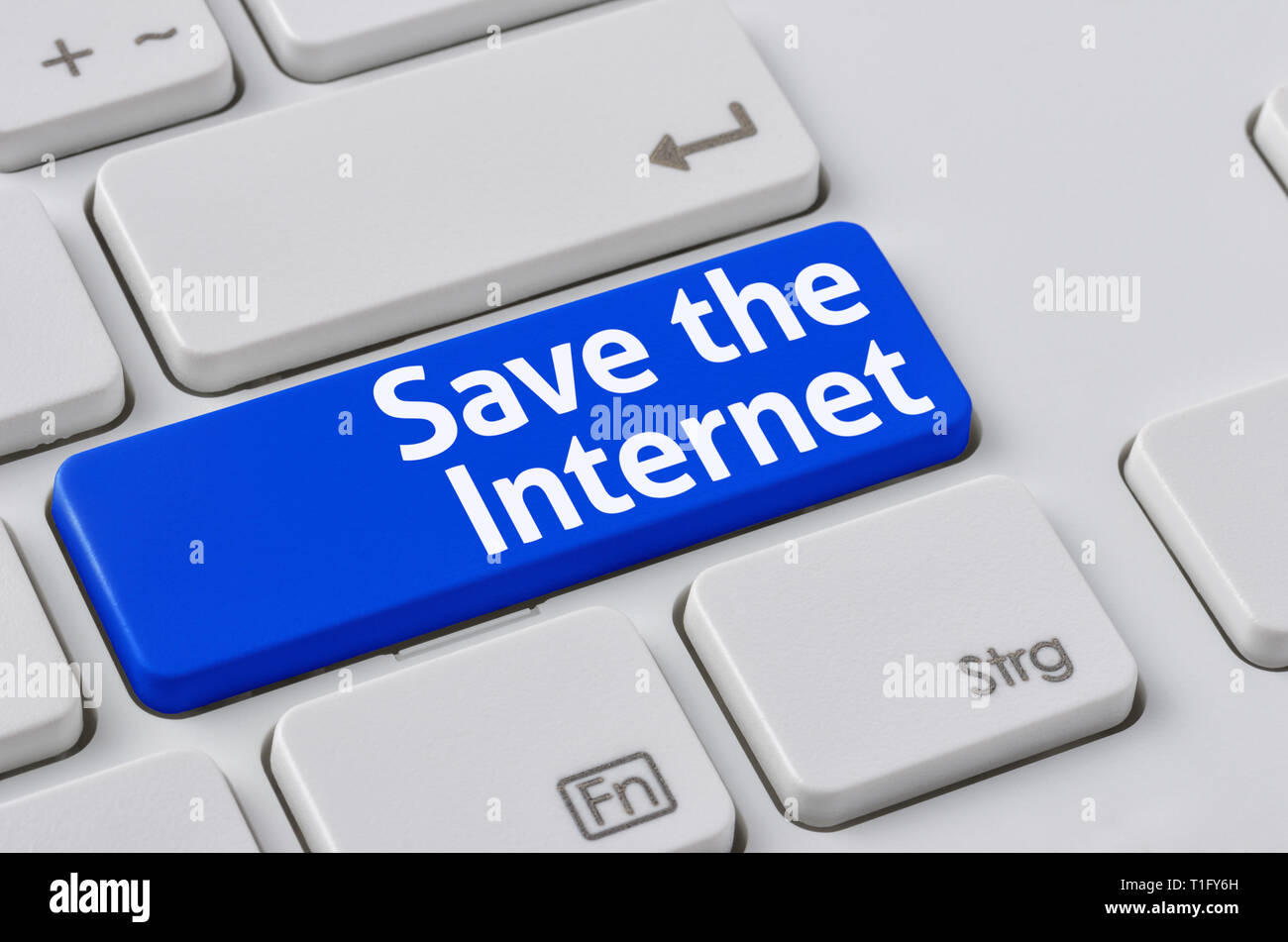 A keyboard with a blue button - Save the internet Stock Photo - Alamy