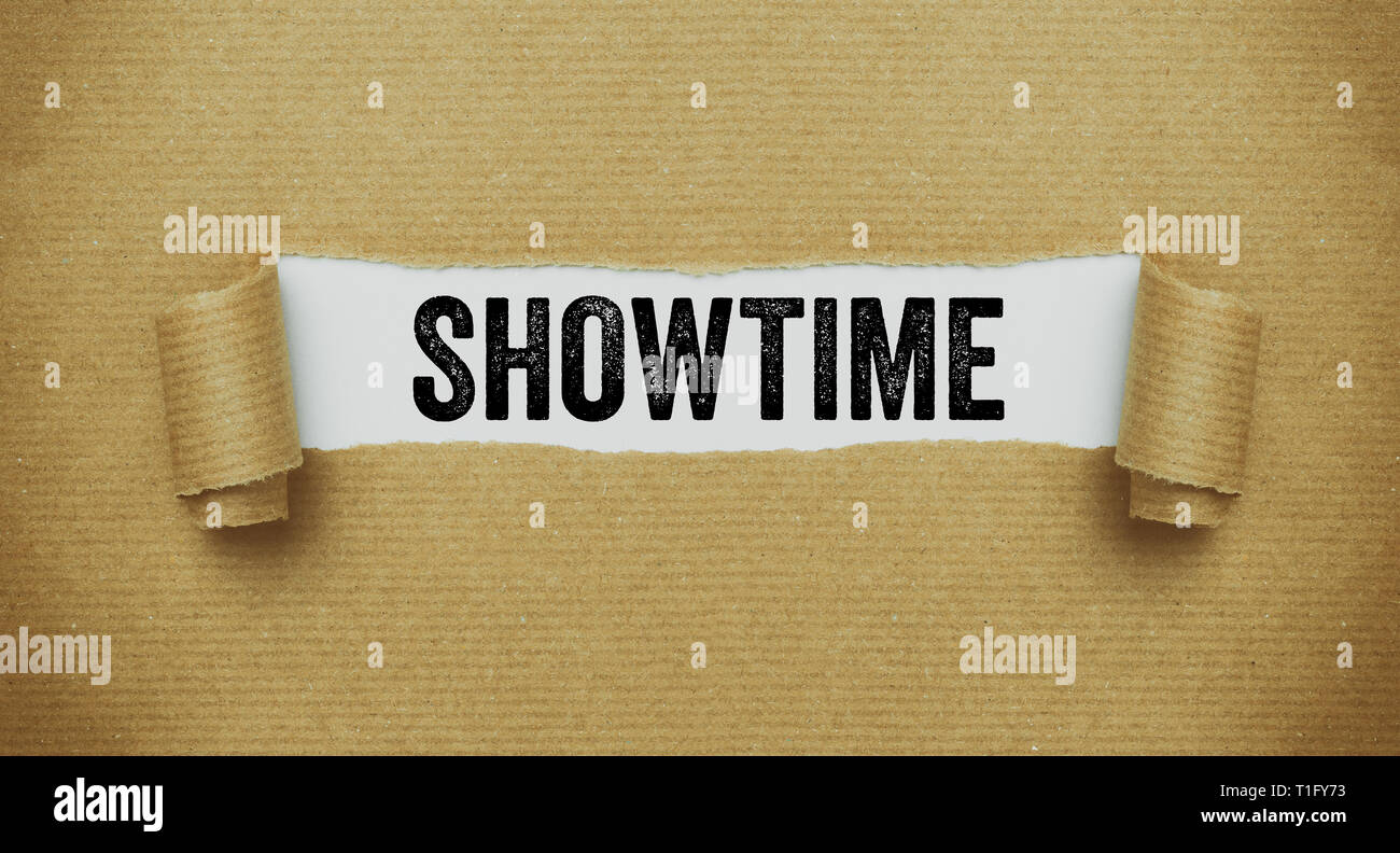 Torn brown paper revealing the word Showtime Stock Photo - Alamy