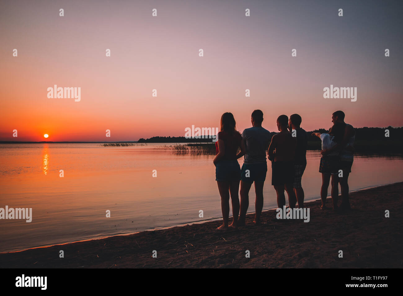 Group young people running sea hi-res stock photography and images - Alamy