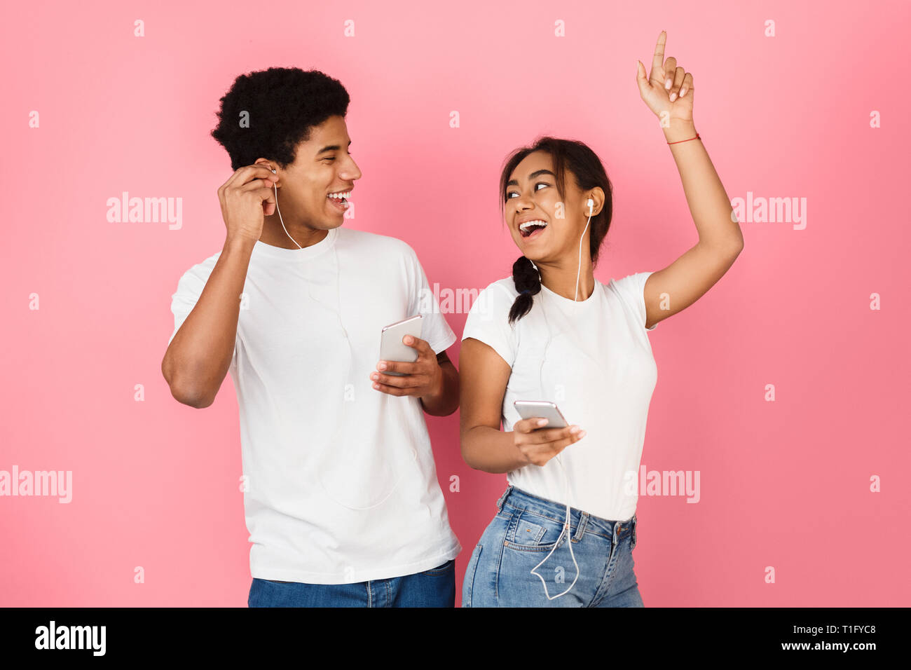 Happy black girl dancing hi-res stock photography and images - Alamy