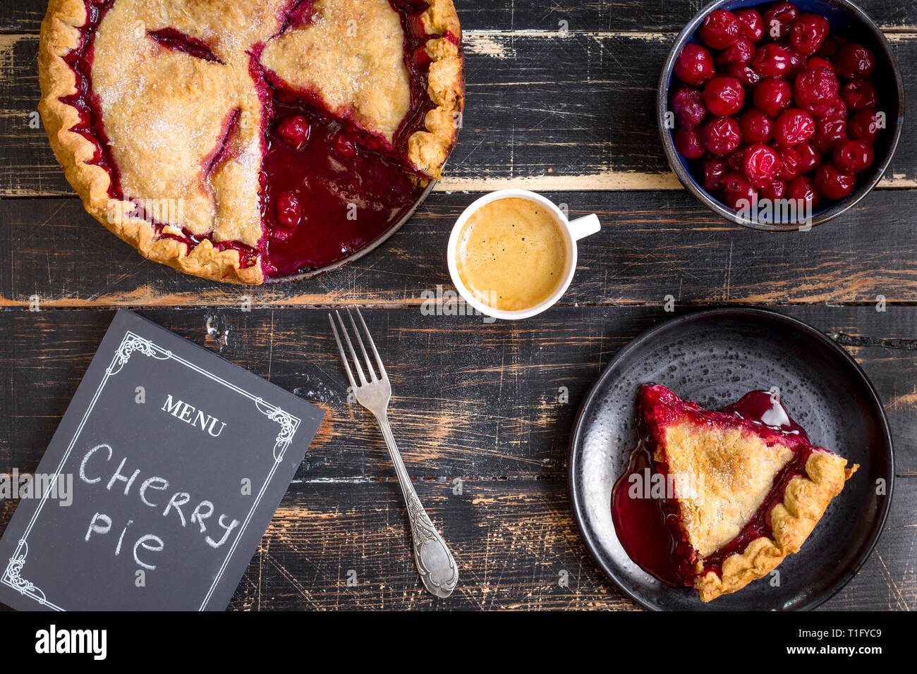 Cherry pie, cup of coffee and menu chalkboard Stock Photo - Alamy
