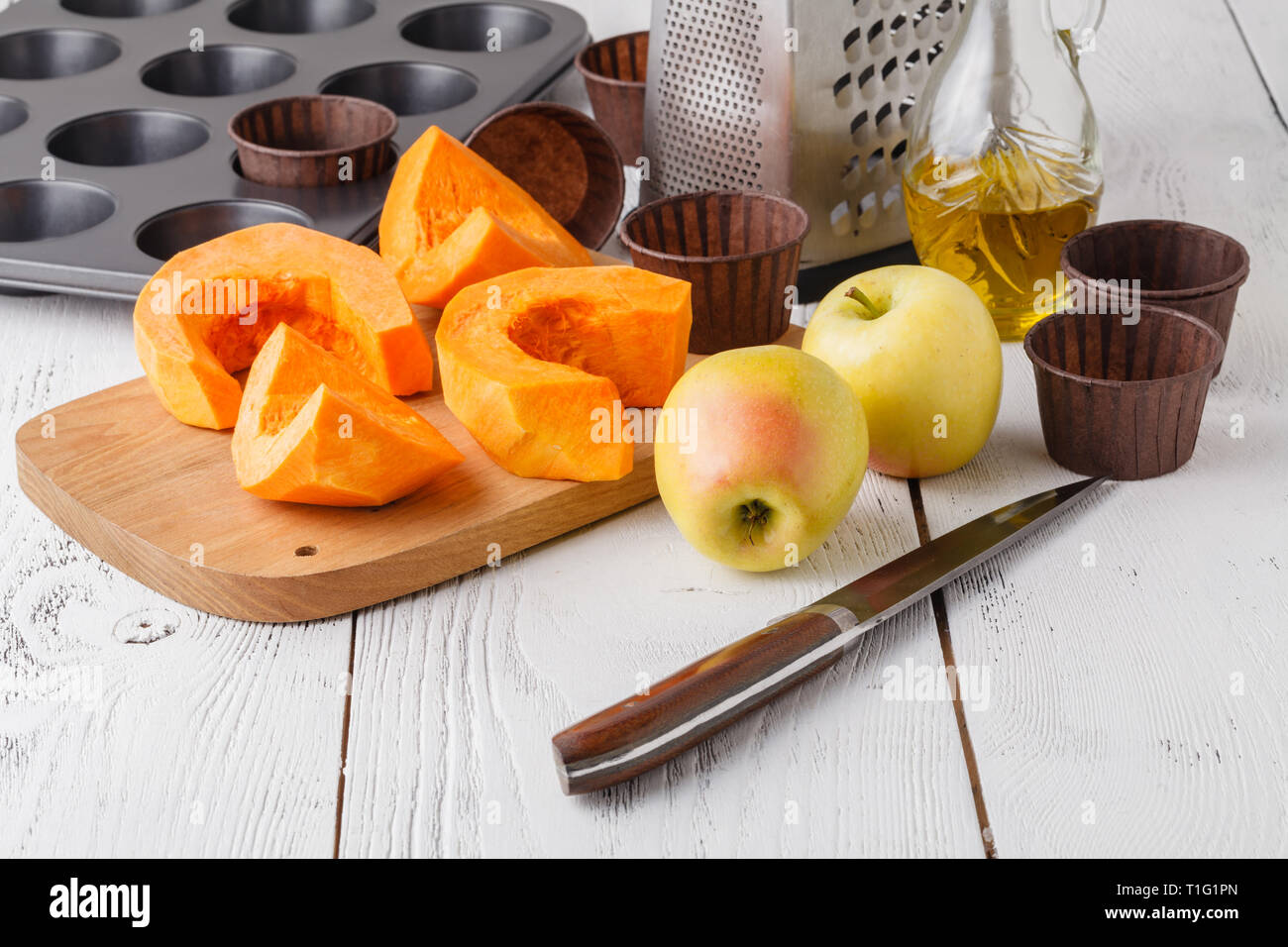 Sliced and chopped pumpkin pieces. Pumpkin chunks on wooden background ...