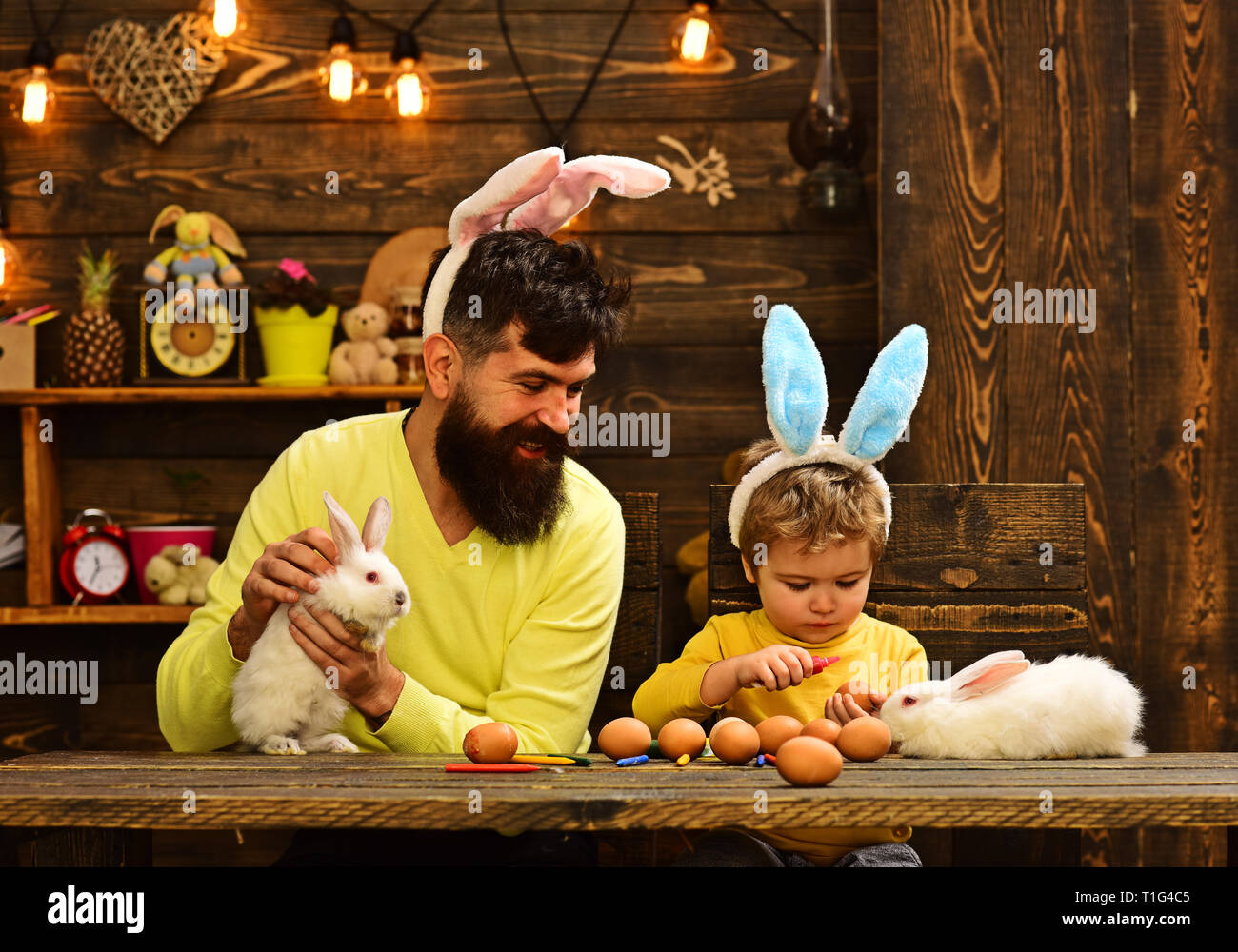 Easter family with fake bunny ears Stock Photo - Alamy