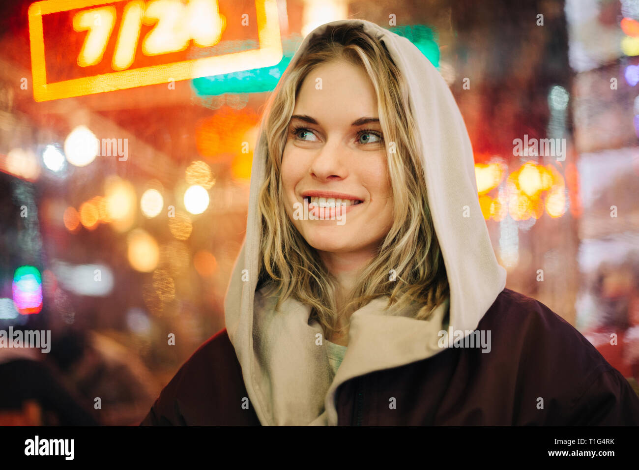 Photo of happy blonde on blurred background of city lights Stock Photo ...
