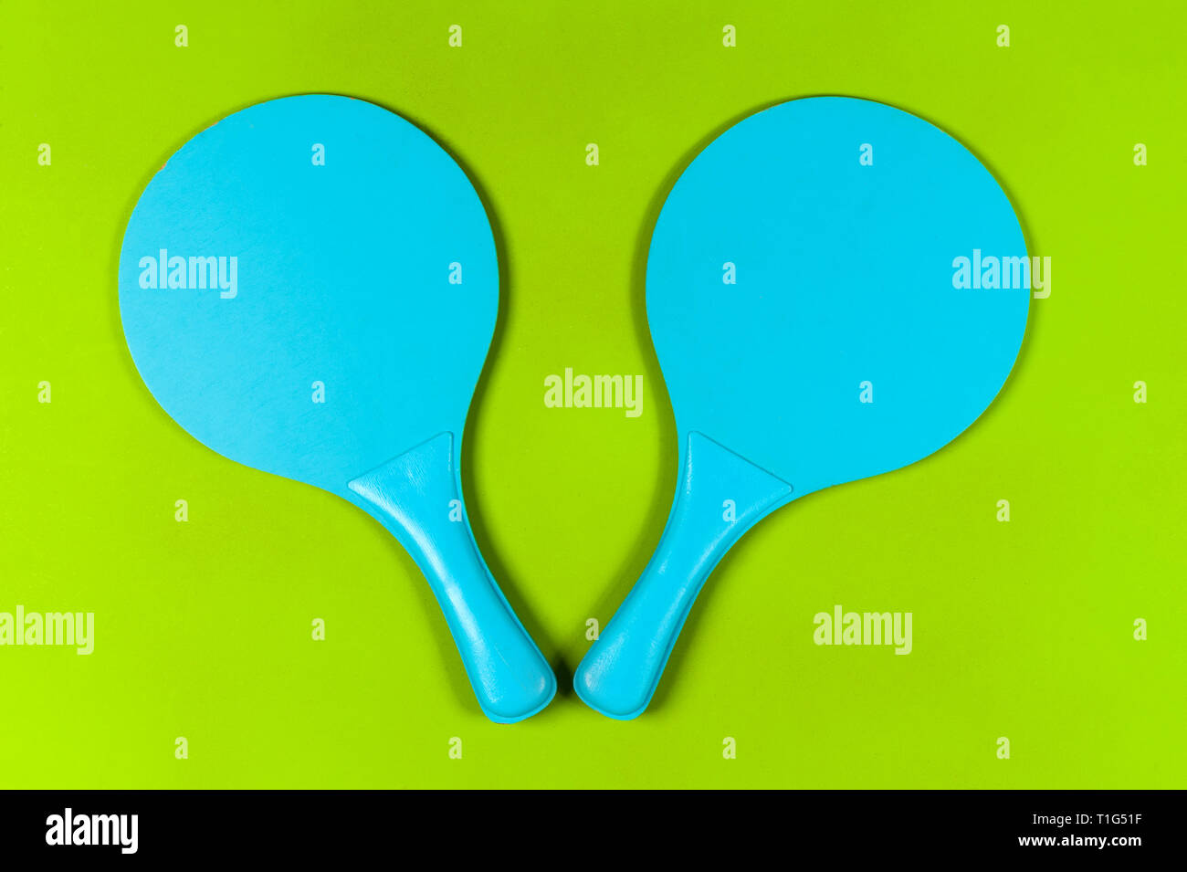 blue table tennis racket on green background Stock Photo - Alamy