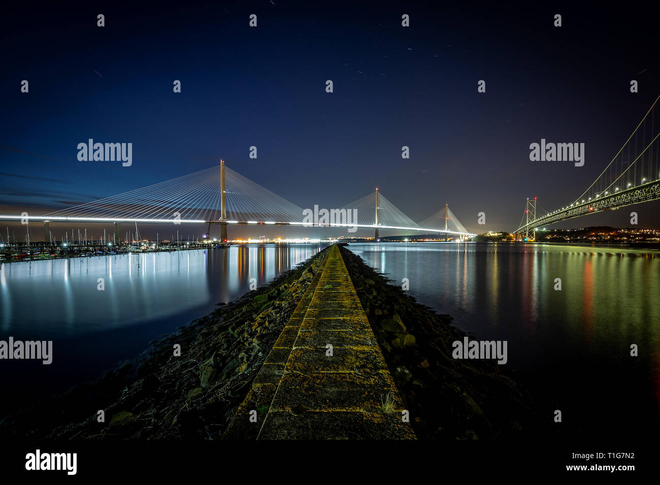 Night-time view overlooking the Queensferry Crossing and older Forth ...