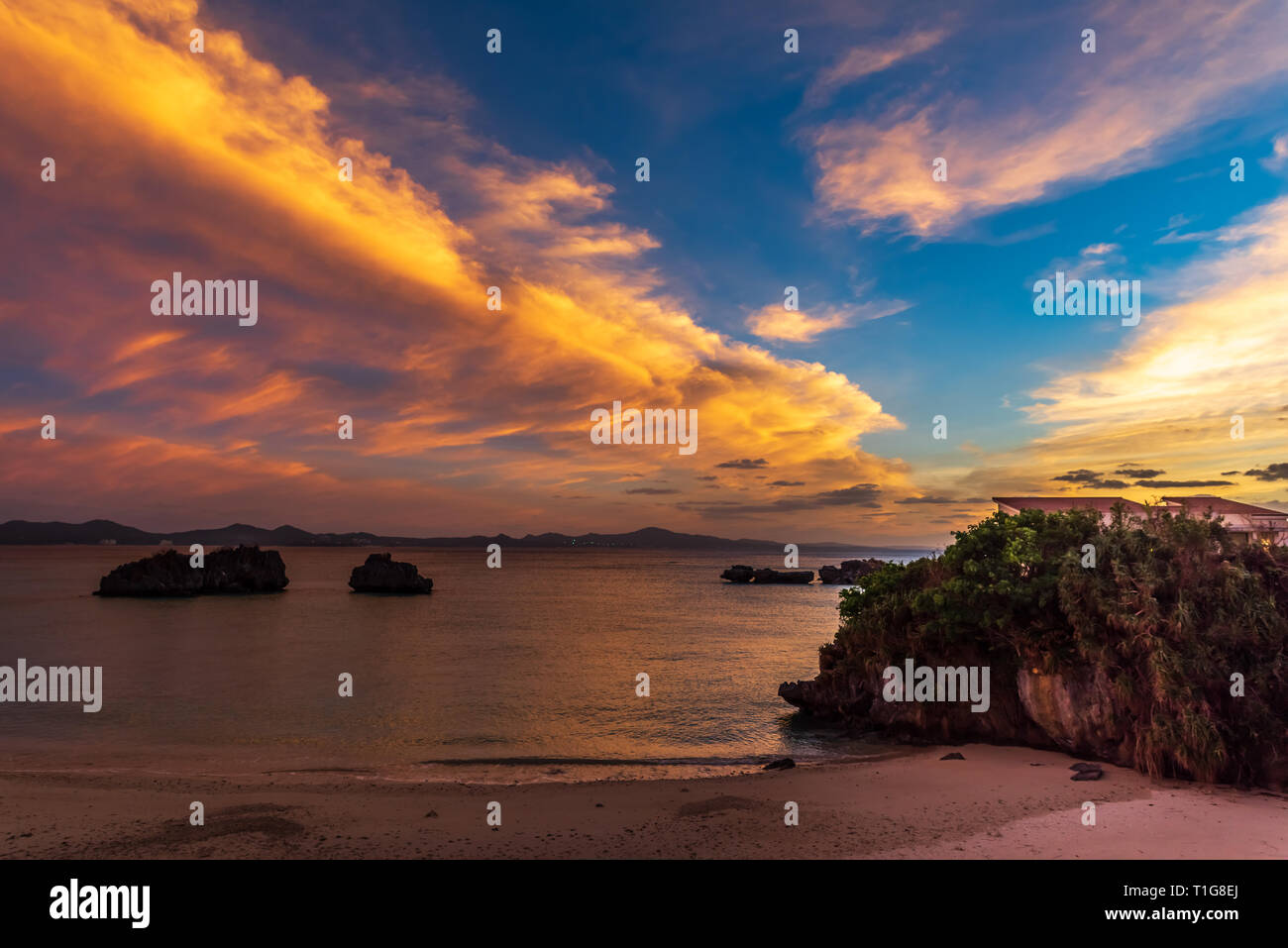Sunset on a beach in Okinawa, Japan Stock Photo - Alamy