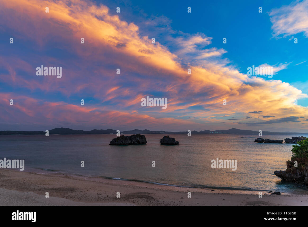 Sunset on a beach in Okinawa, Japan Stock Photo - Alamy
