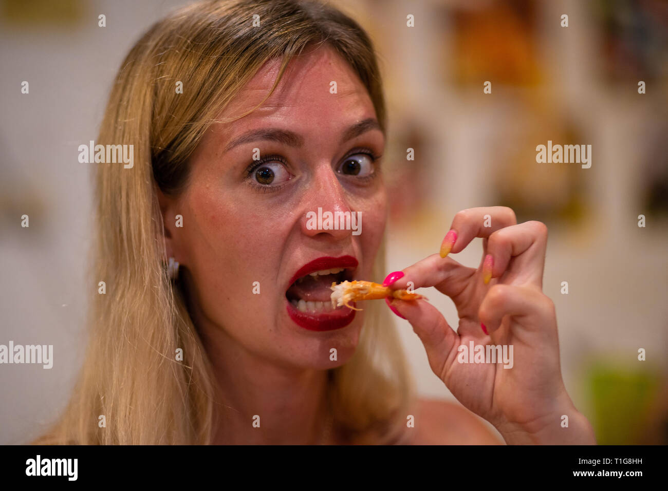 Eating prawn with finger hi-res stock photography and images - Alamy