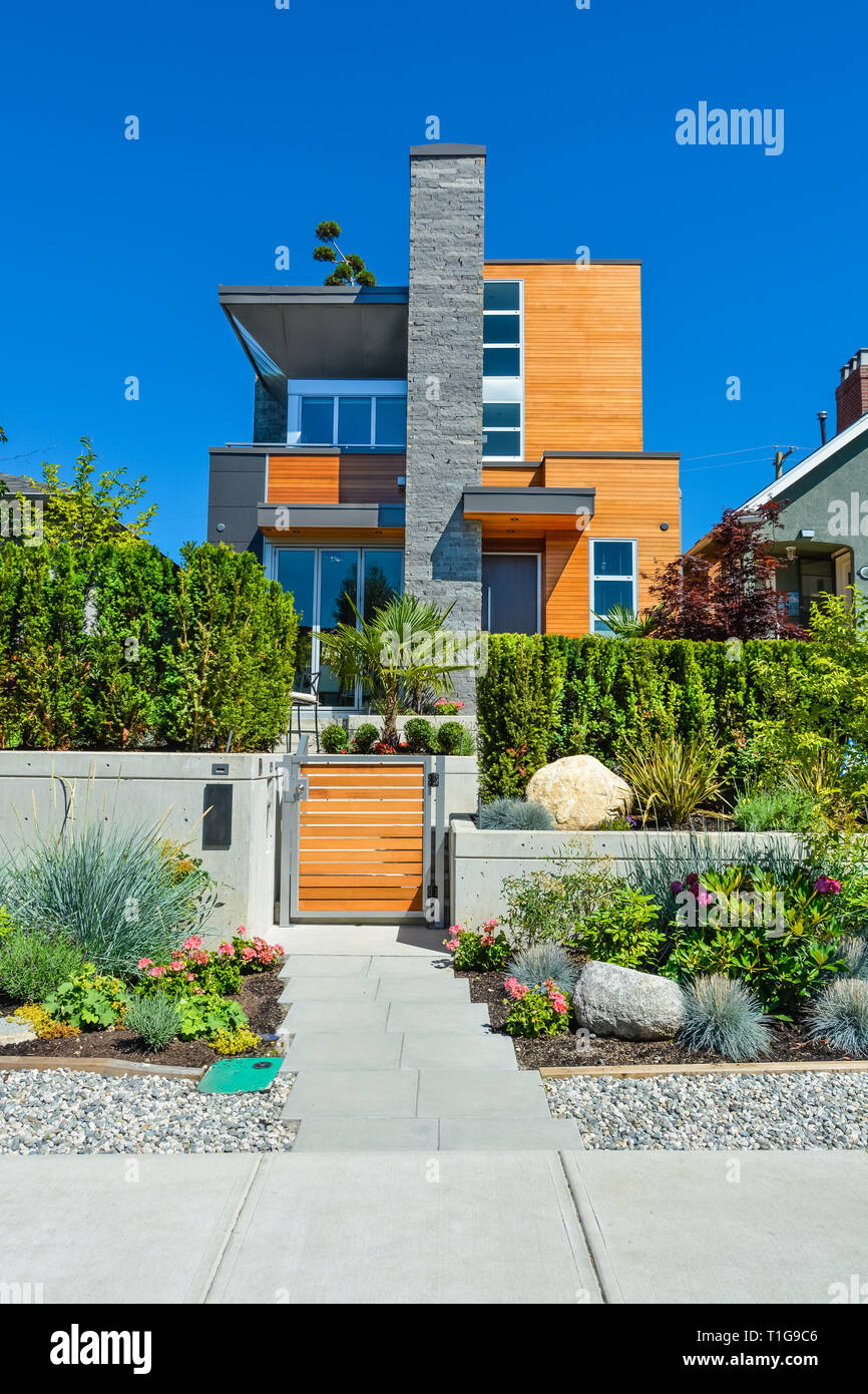 New modern residential house with concrete pathway in front Stock Photo ...
