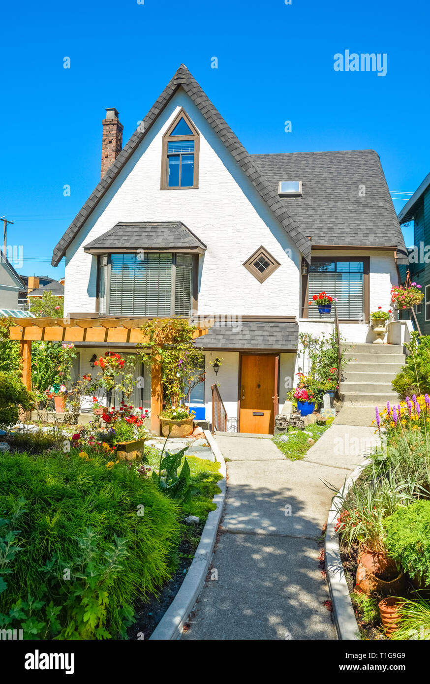 Old style family house with landscaped front yard and pathway to the ...