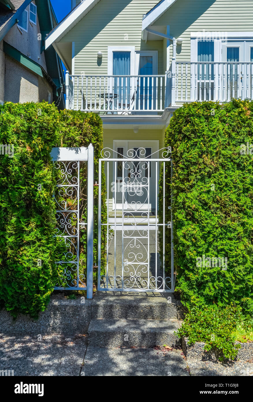 Decorated metal gate of residential house entrance Stock Photo - Alamy