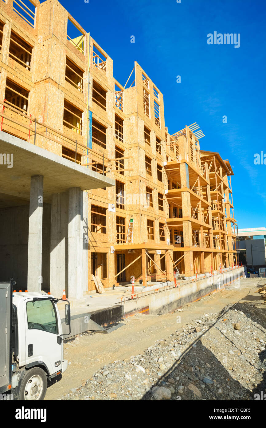 Brand new low-rise building on sunny day in British Columbia, Canada ...