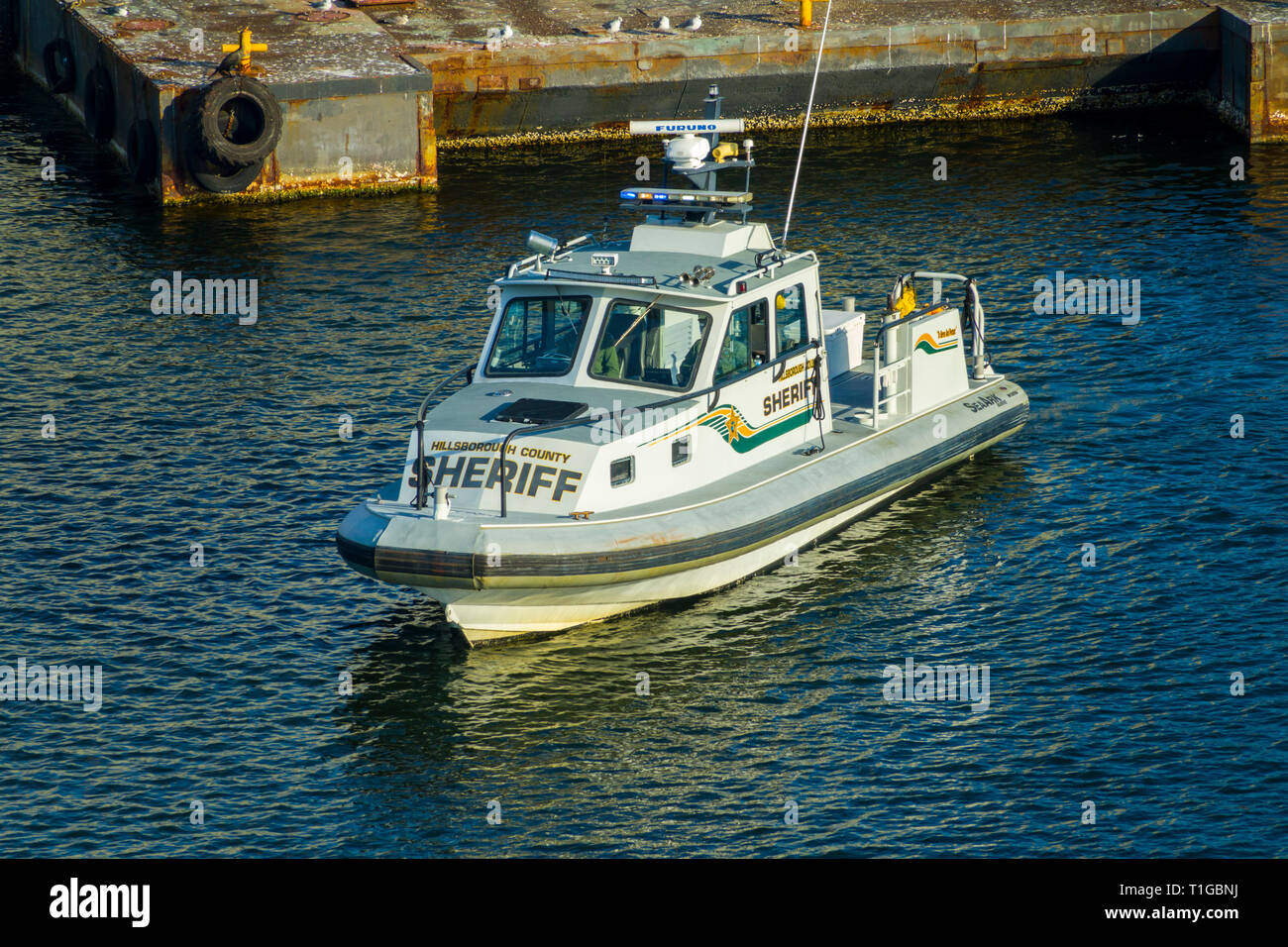 Sheriff boat meets with the US Coast Guard ship in Tampa Florida ...