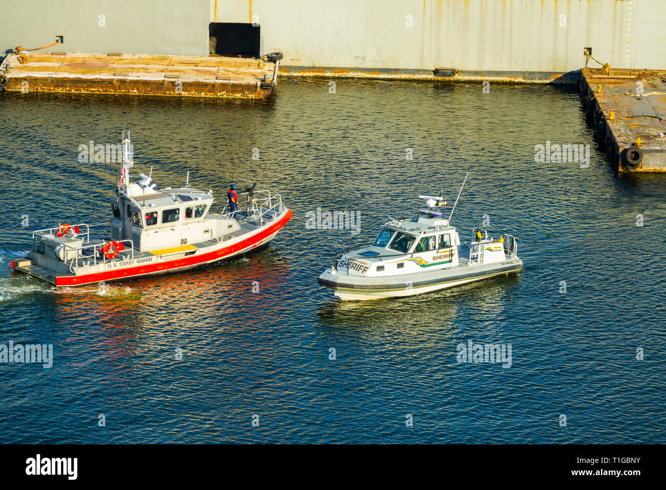 Sheriff boat meets with the US Coast Guard ship in Tampa Florida ...