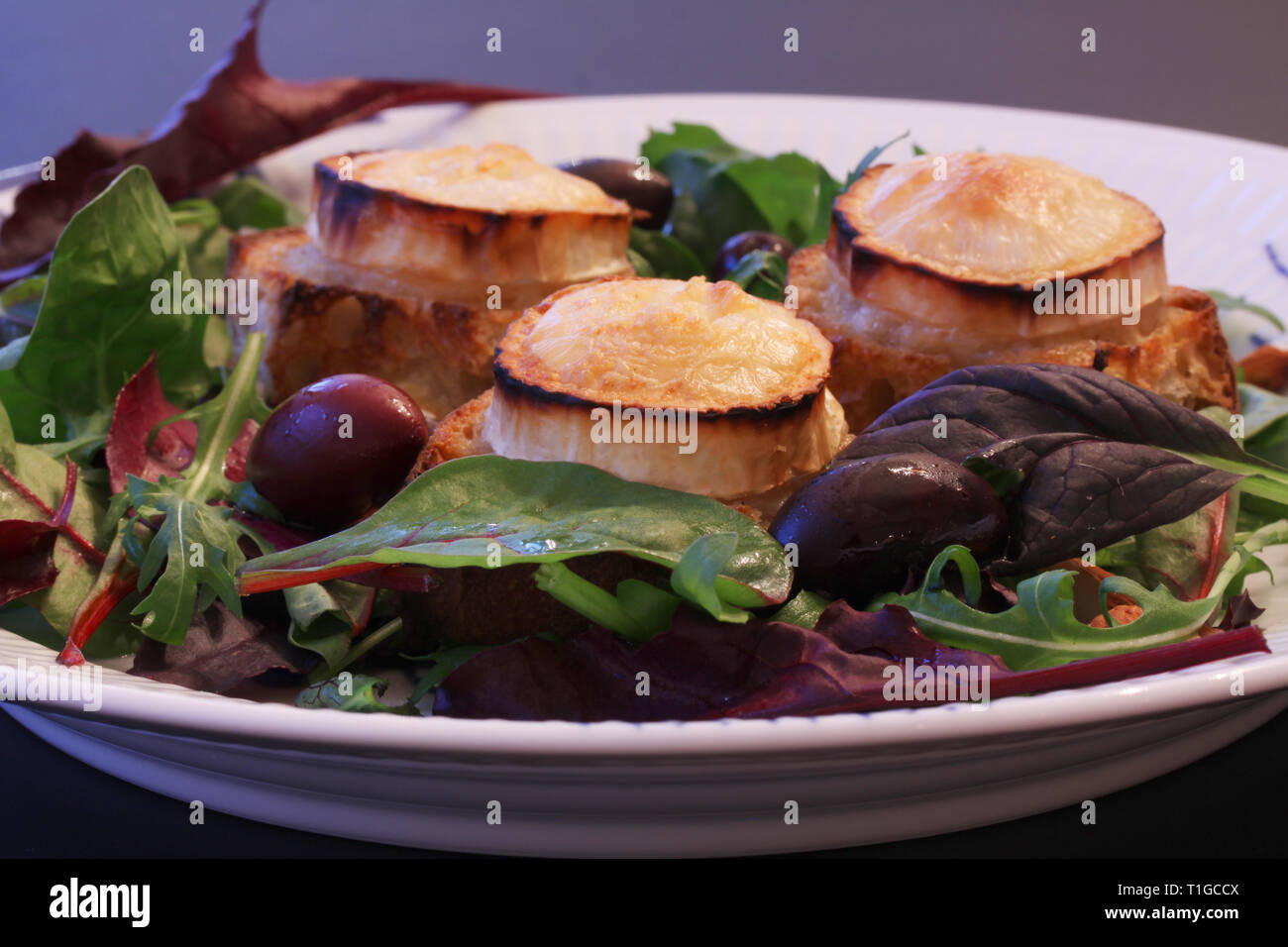 Warm chevre chaud goat cheese baked on rustic bread with green salad ...